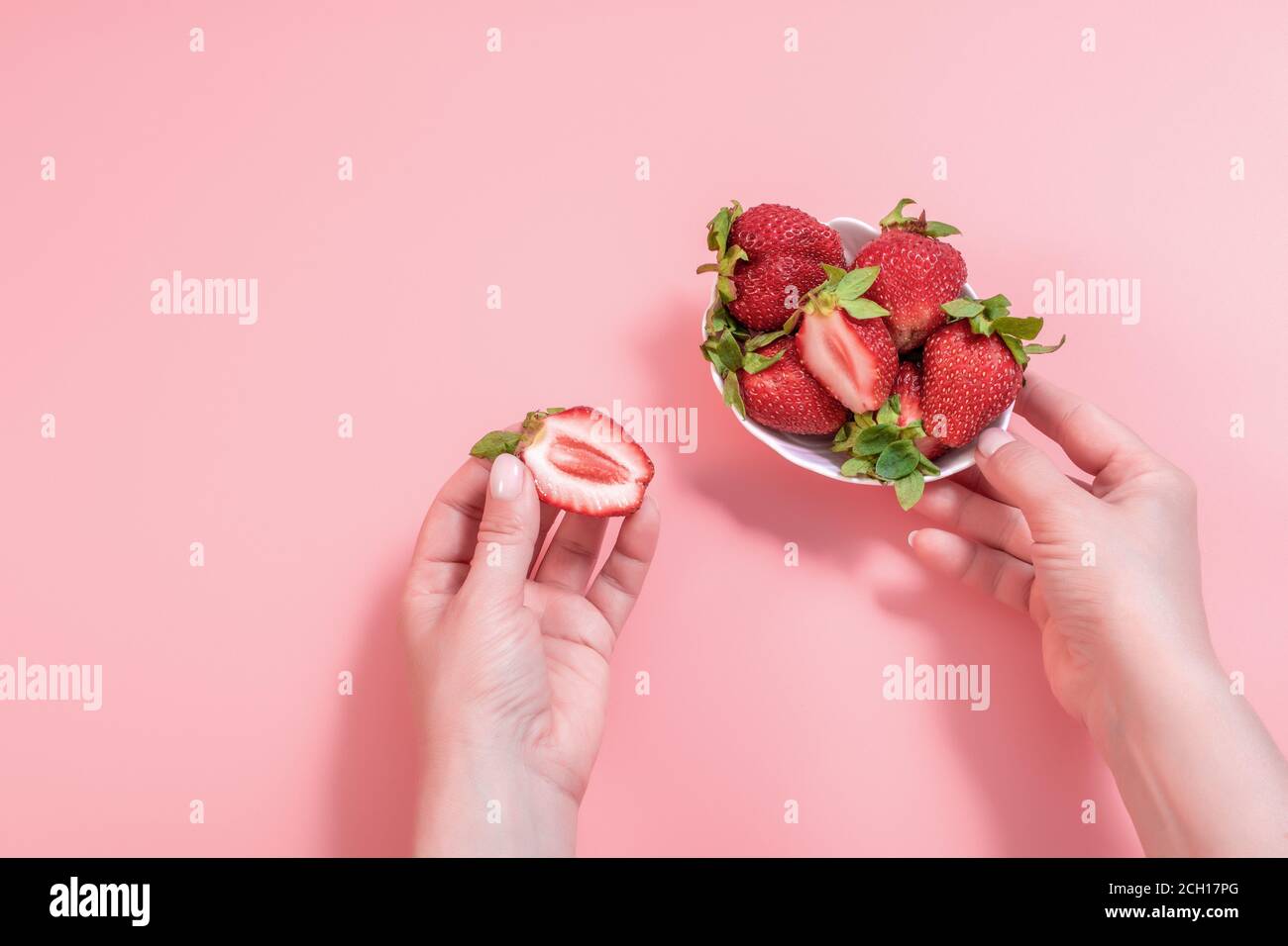 Hand takes ripe strawberry in hi-res stock photography and images - Alamy