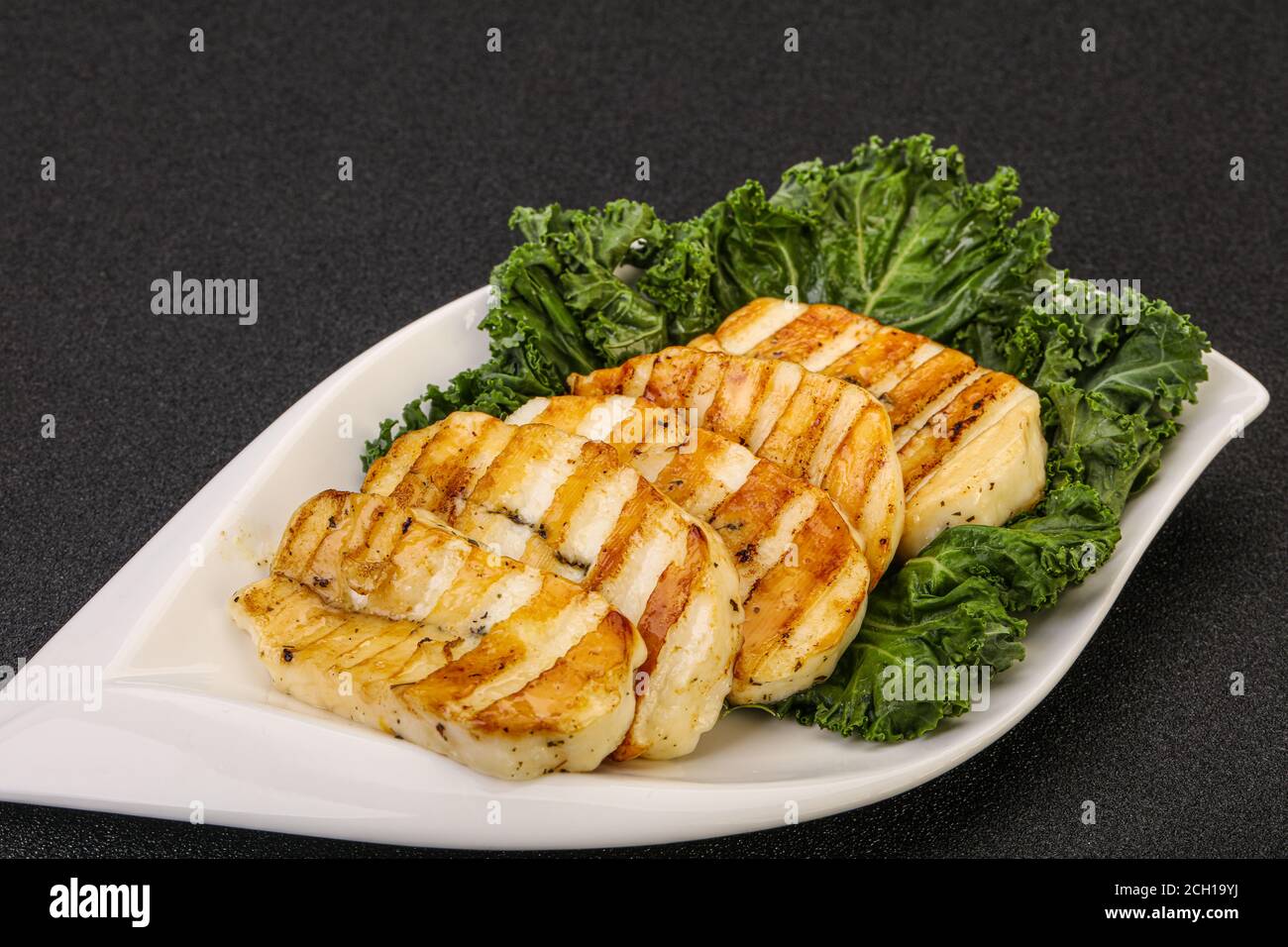 Grilled Greek haloumi cheese with herbs and spices Stock Photo - Alamy