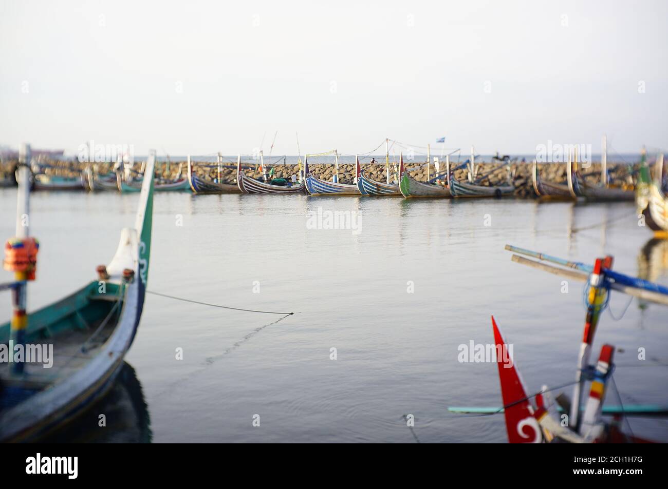 Traditional boats dock at shore Stock Photo - Alamy
