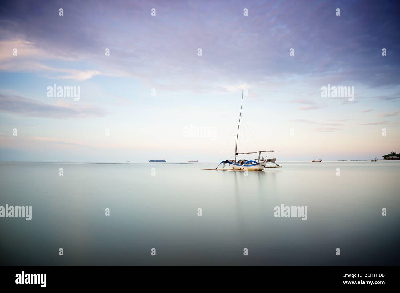 Traditional boats dock at shore Stock Photo - Alamy