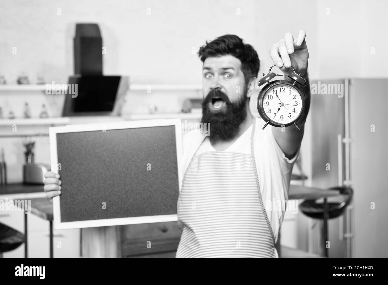 Time management is key ingredient in eating right. Man with blackboard ...