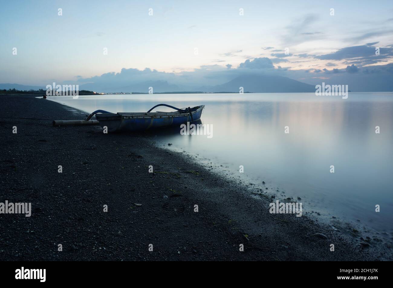 Traditional boats dock at shore Stock Photo - Alamy