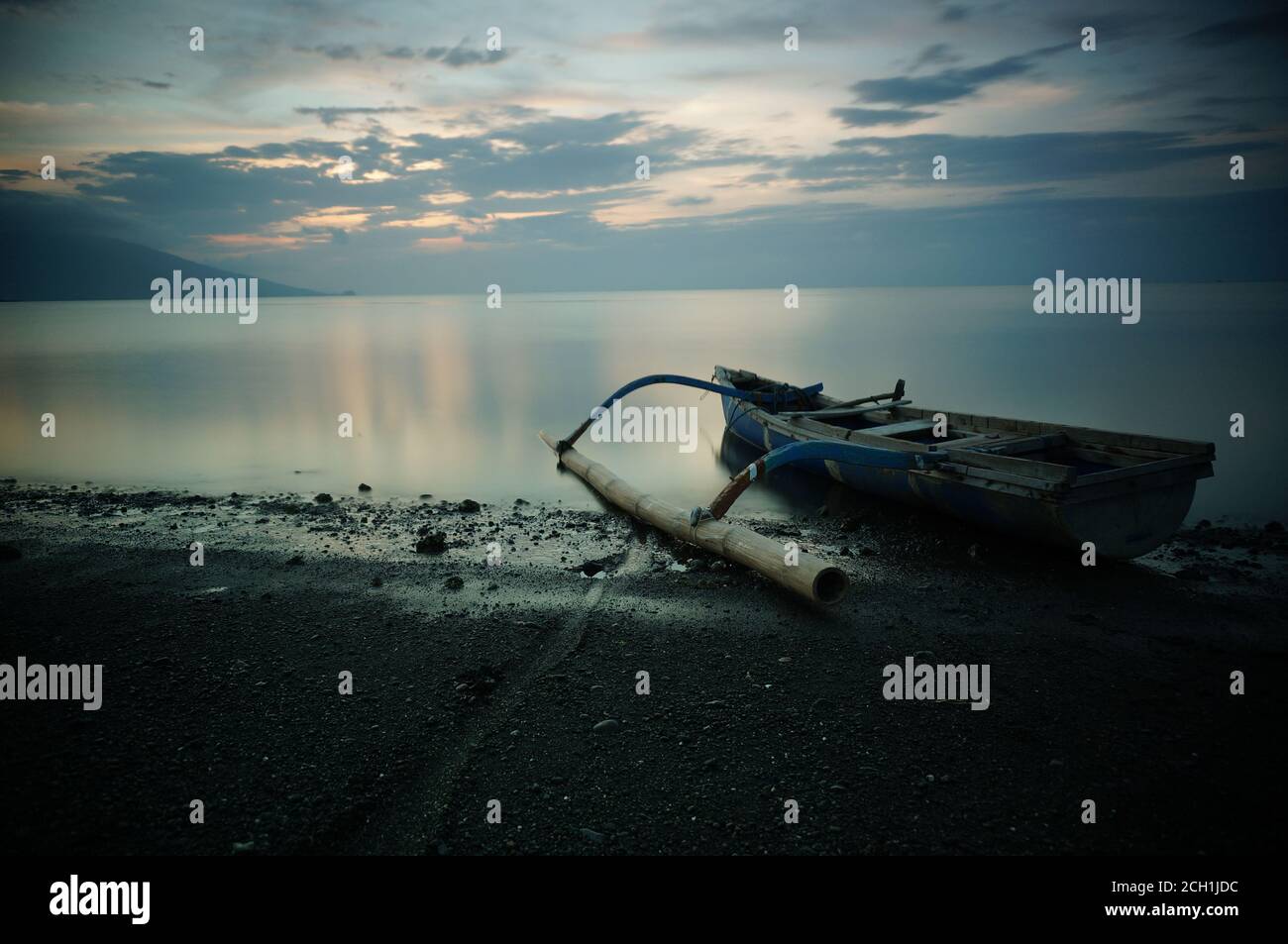 Traditional boats dock at shore Stock Photo - Alamy