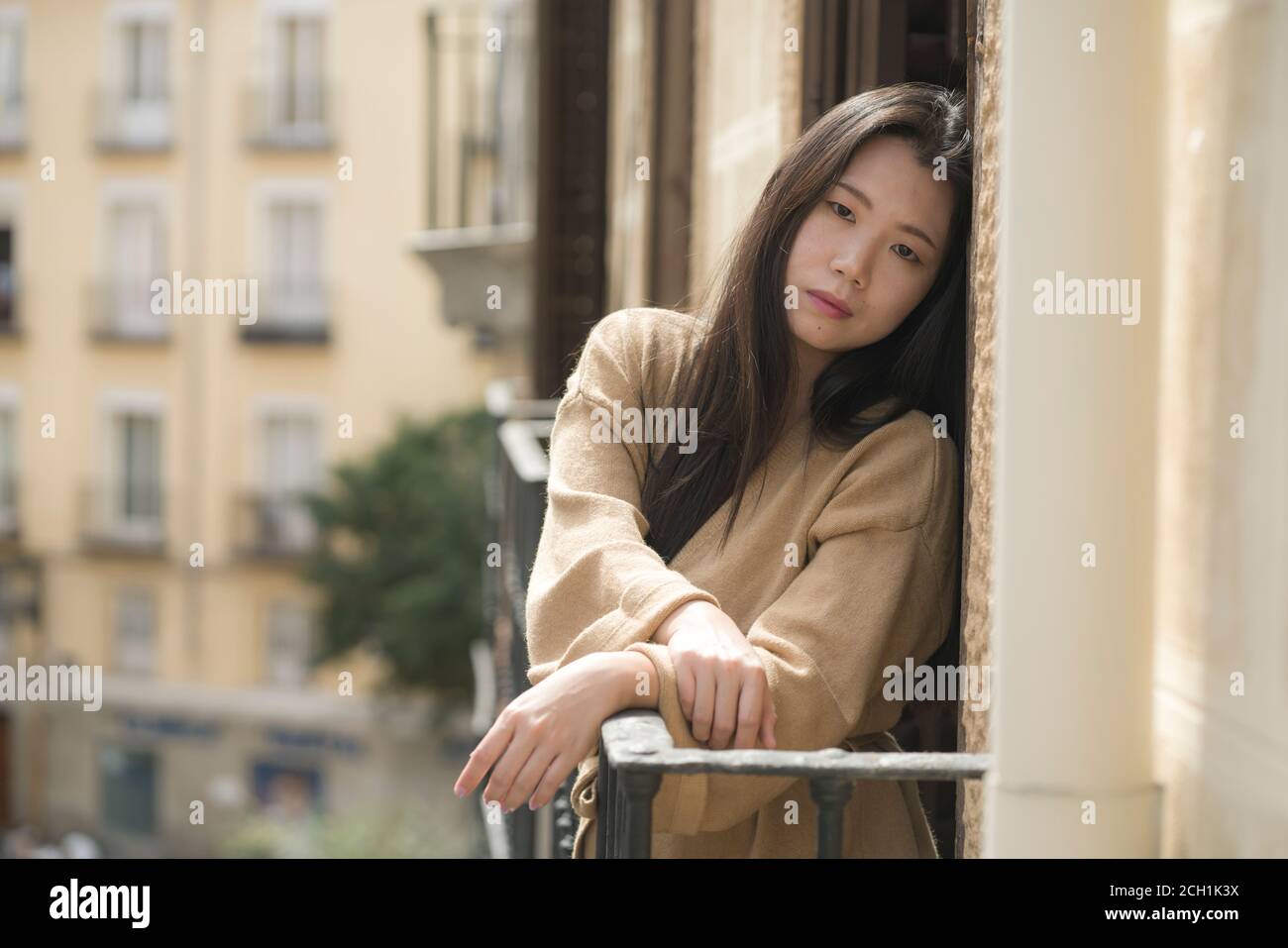 dramatic portrait of young beautiful sad and depressed Asian Chinese ...