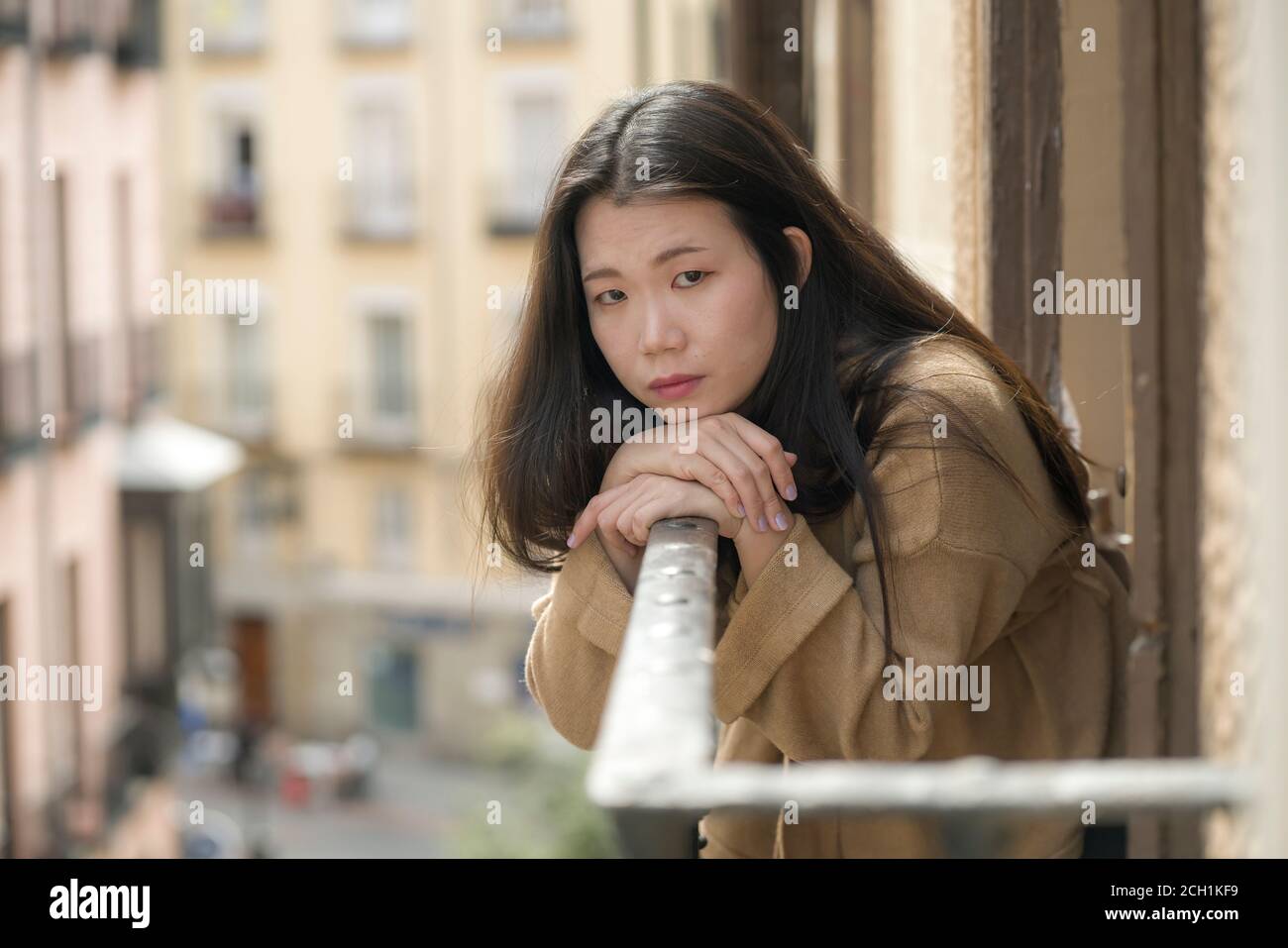 dramatic portrait of young beautiful sad and depressed Asian Chinese ...