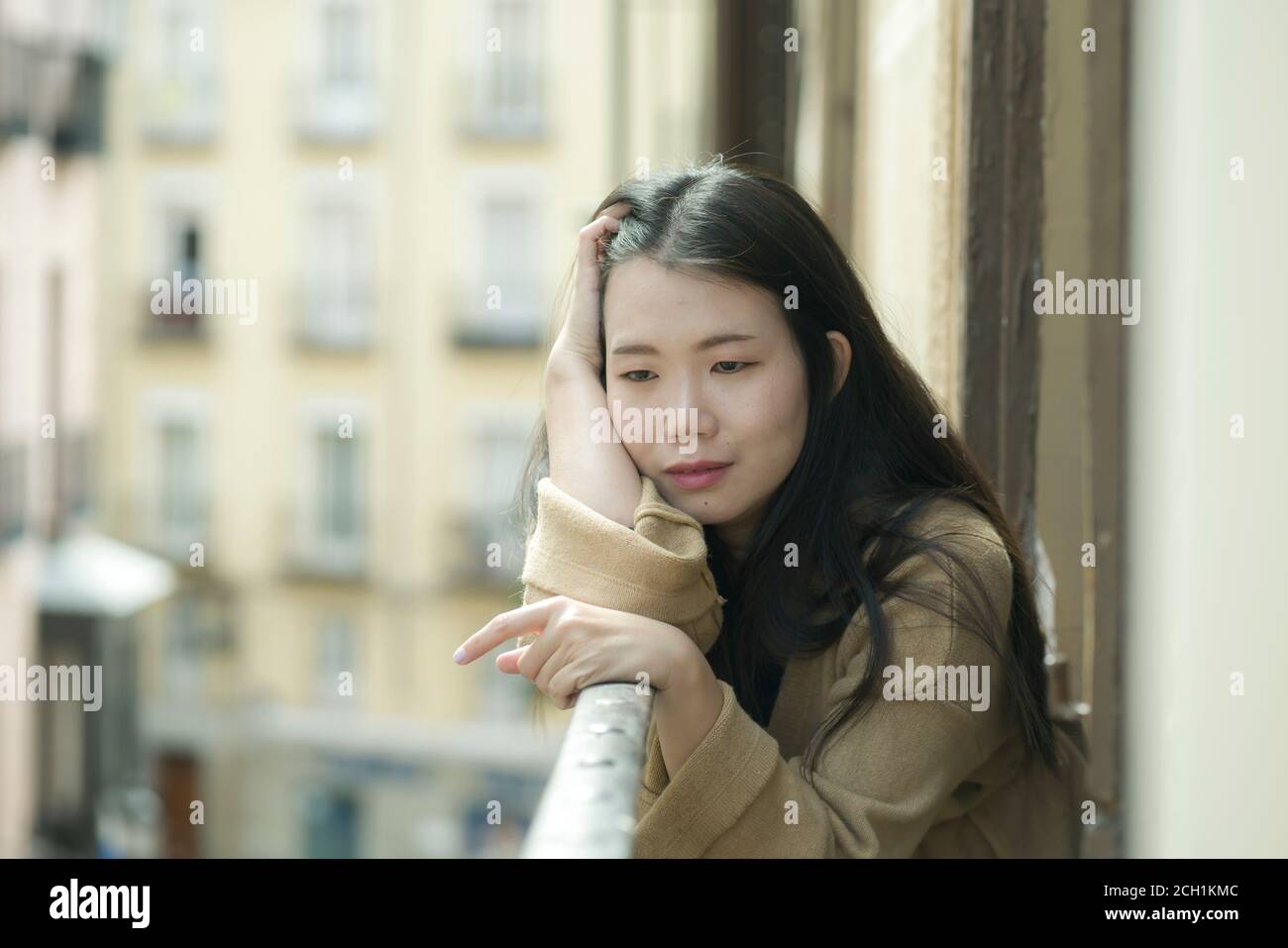 dramatic portrait of young beautiful sad and depressed Asian Chinese ...