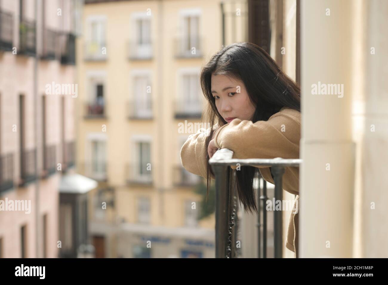 dramatic portrait of young beautiful sad and depressed Asian Korean ...