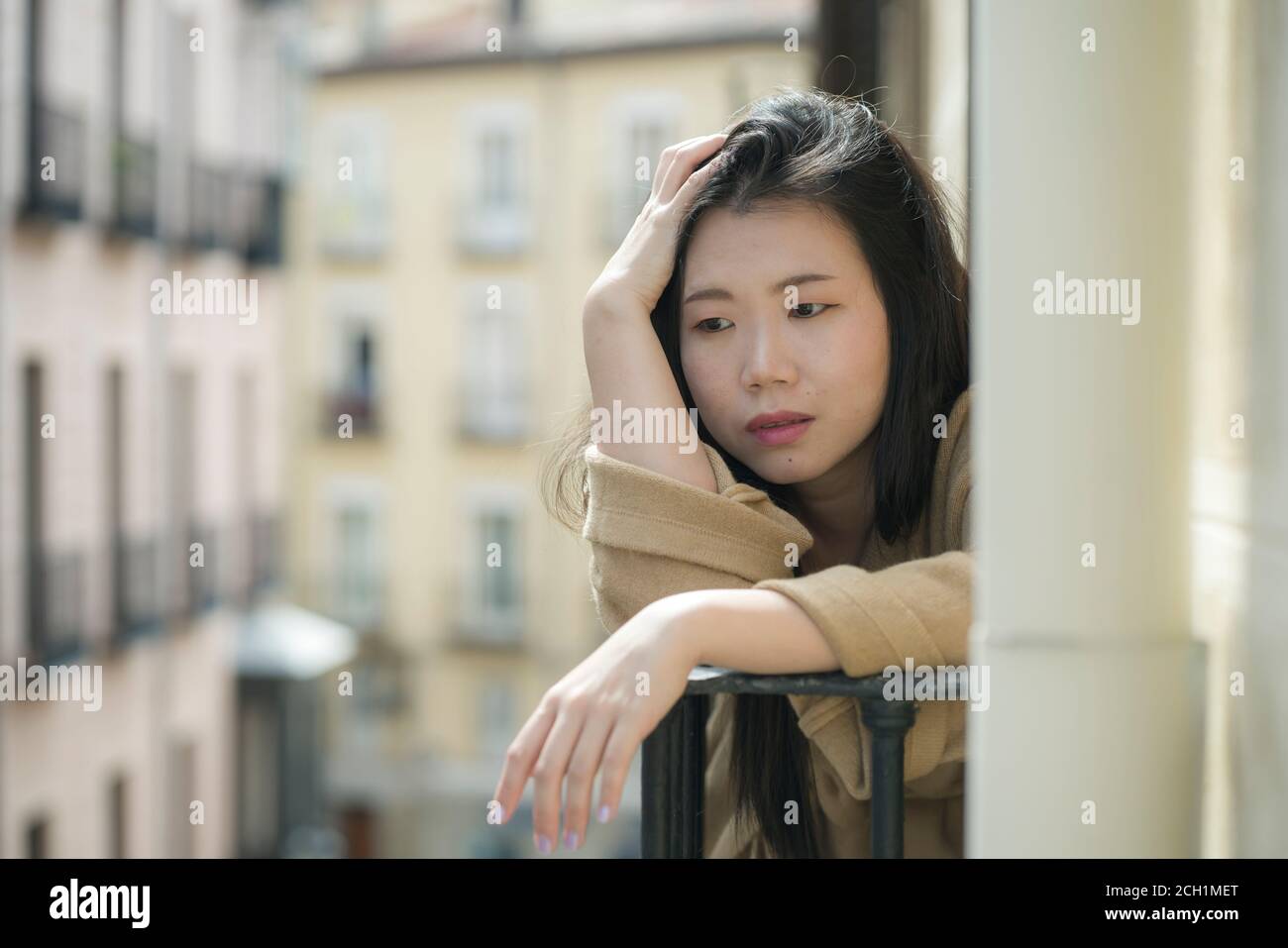 dramatic portrait of young beautiful sad and depressed Asian Korean ...