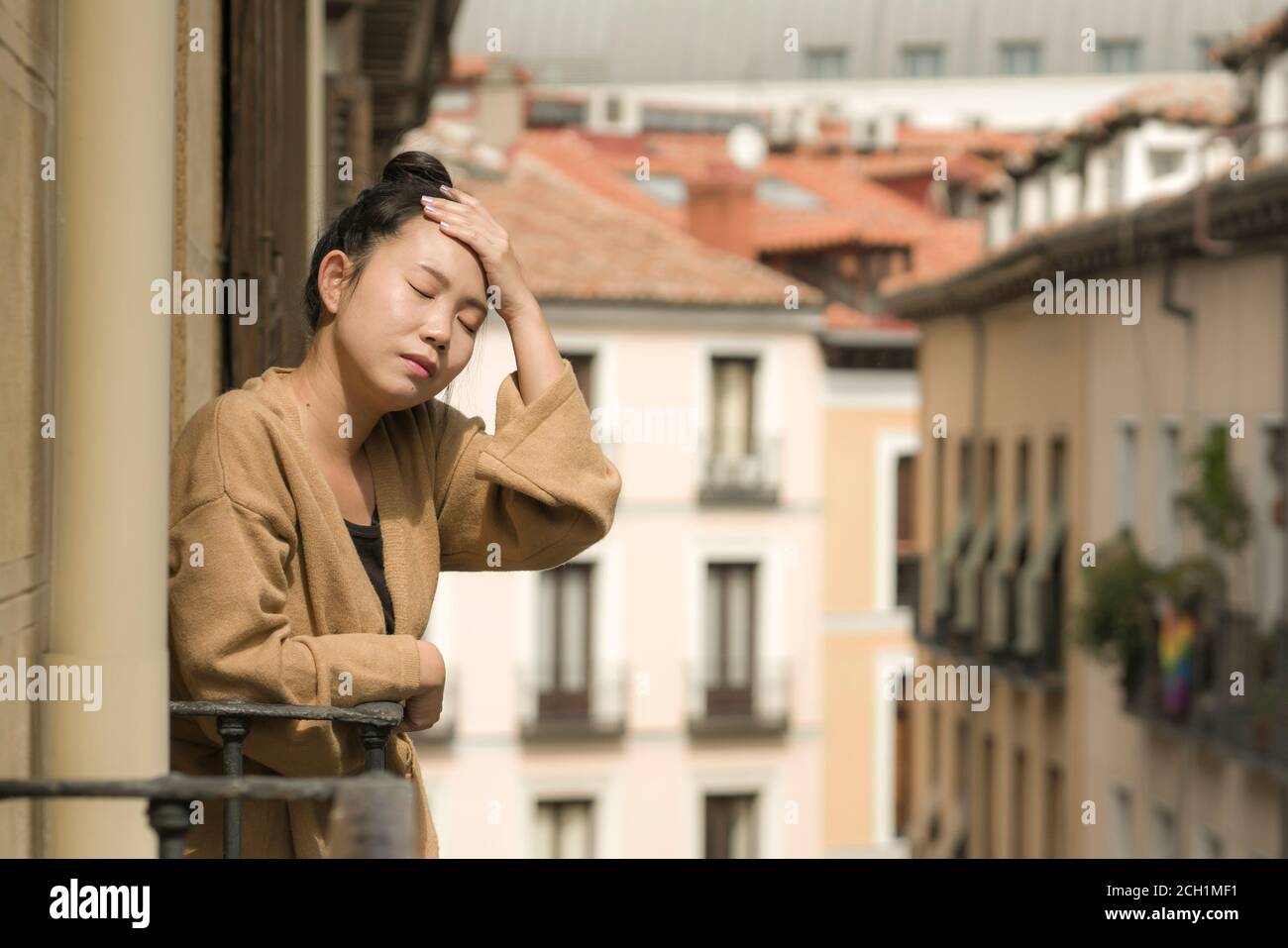 dramatic portrait of young beautiful sad and depressed Asian Korean ...