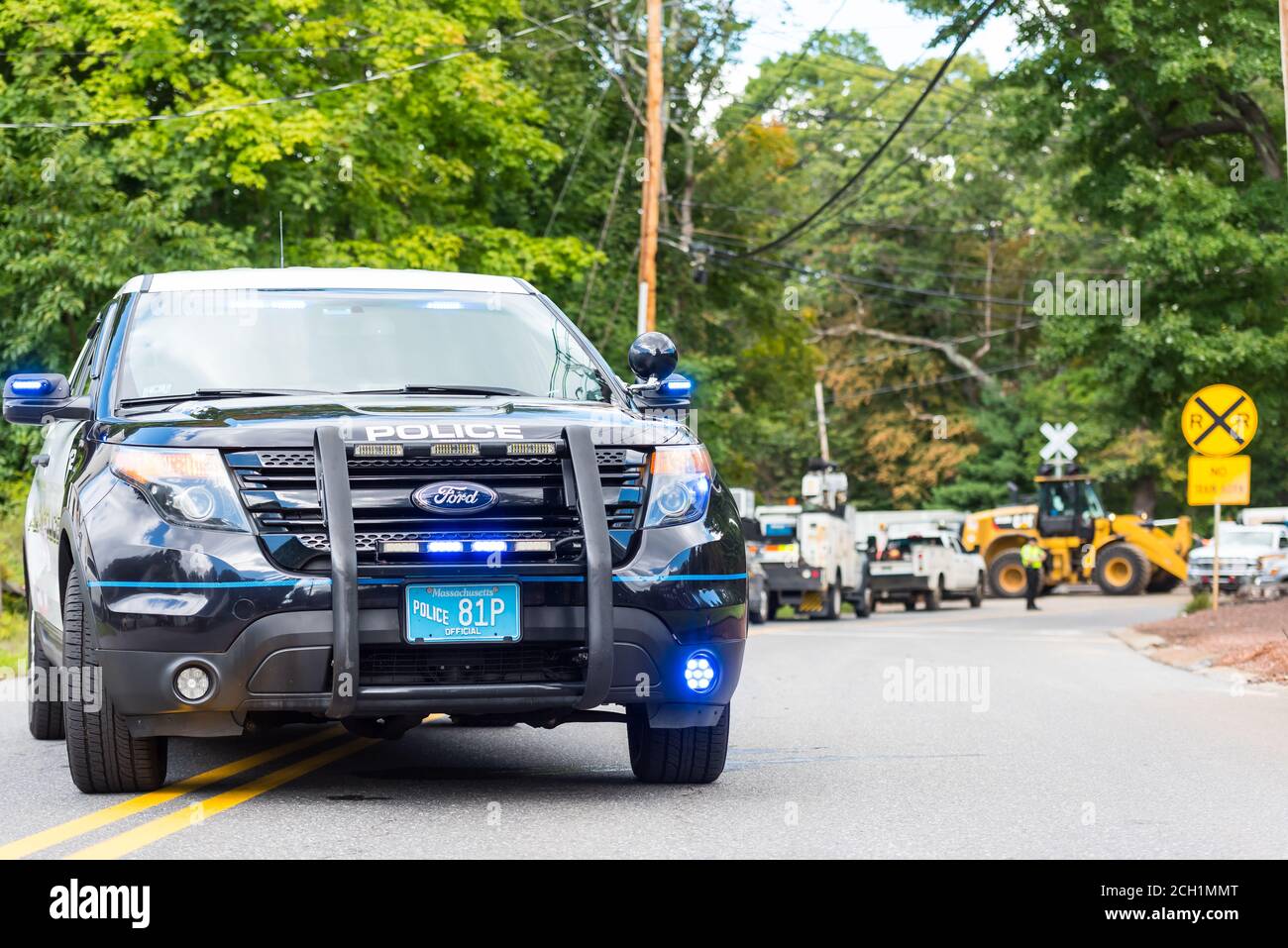 Closeup of an Acton Police vehicle blocking the road before a ...