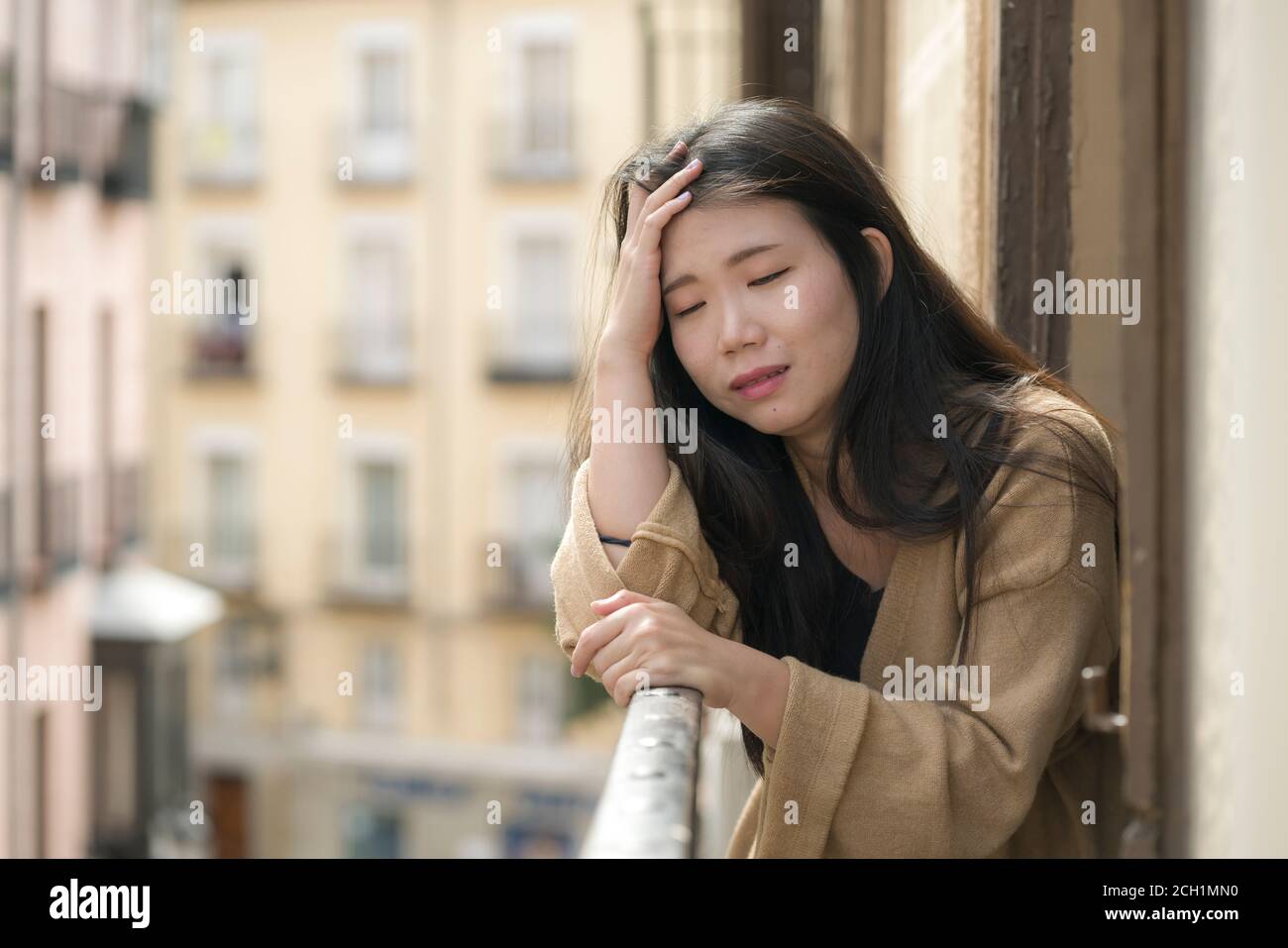 dramatic portrait of young beautiful sad and depressed Asian Korean ...