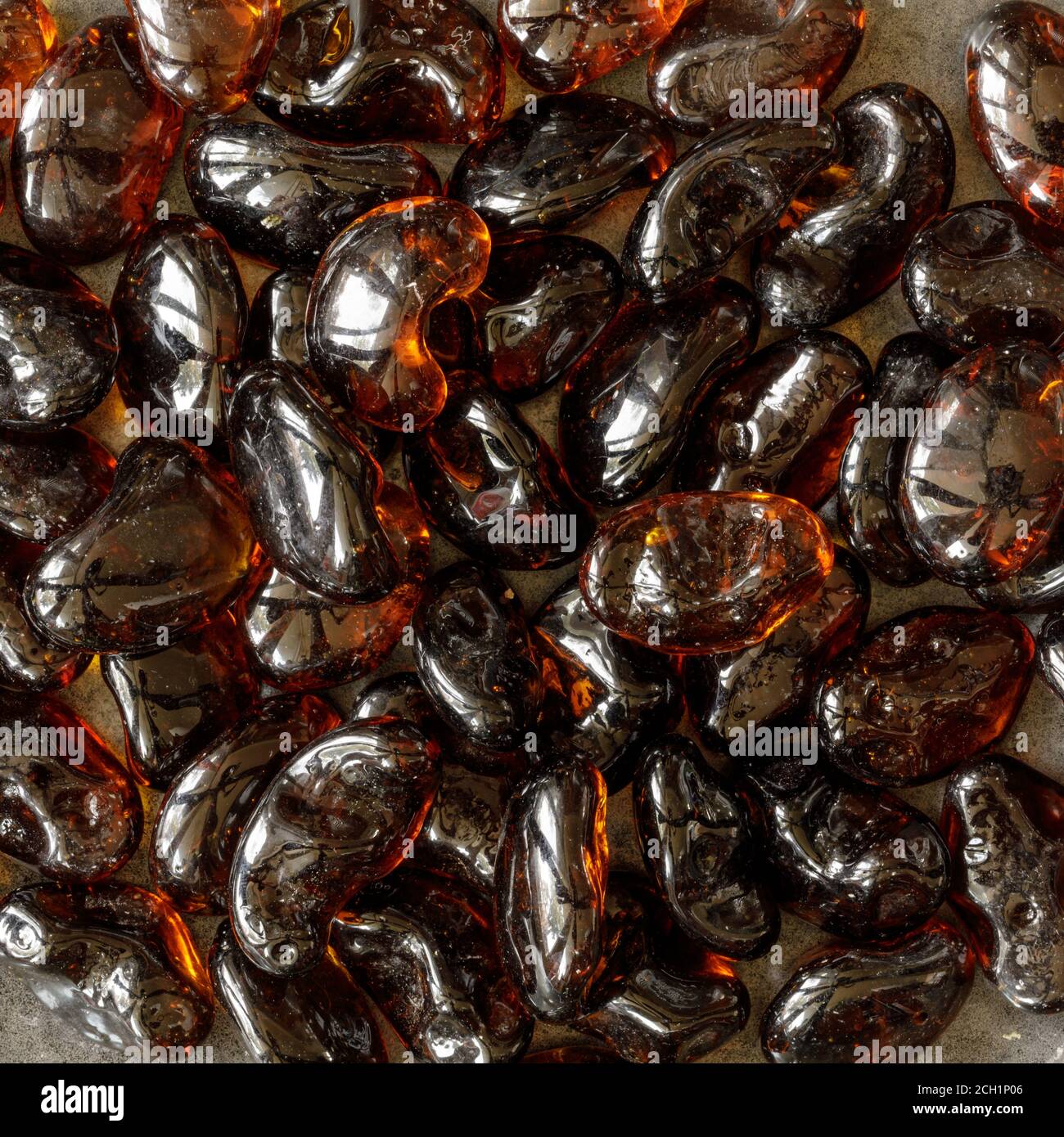 Tumbled and Tempered Amber Jellybean Fire Glass Nuggets Stock Photo - Alamy