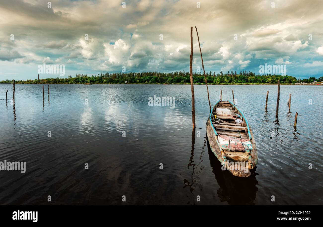 Fishing boat with view of landscape nature in sky and cloud storm and ...