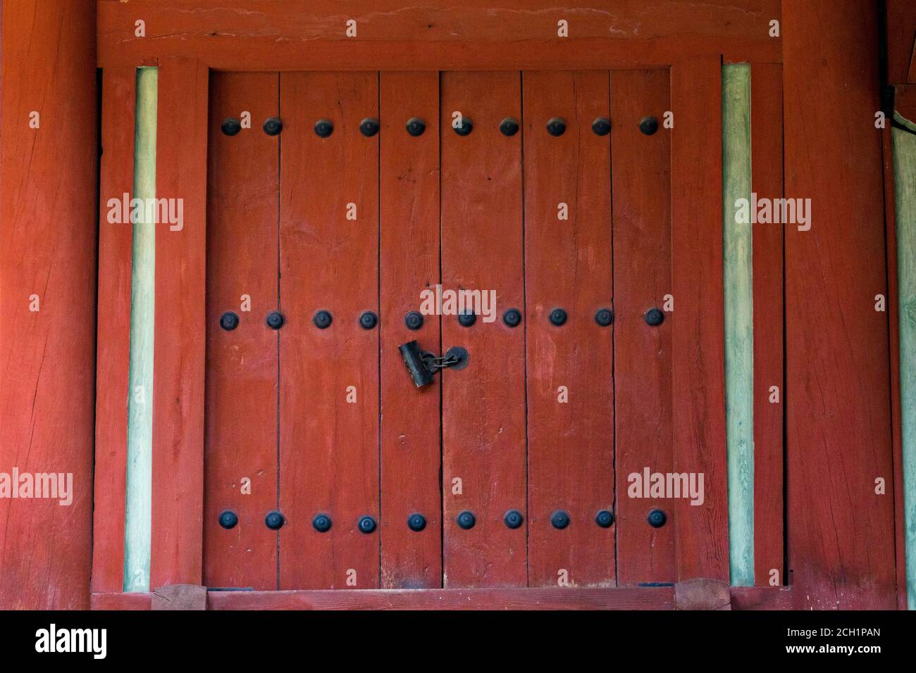 Red wooden Korean style door to the spirit chamber of former kings at ...