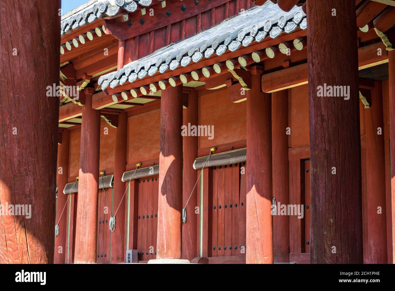 Red wooden Korean style door to the spirit chamber of former kings at ...