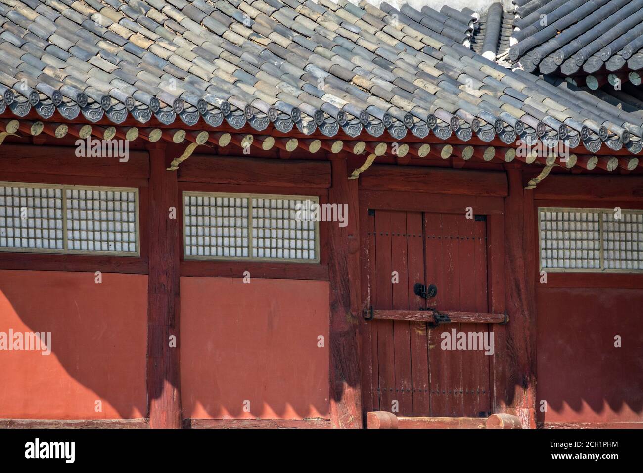Red wooden Korean style door to the spirit chamber of former kings at ...