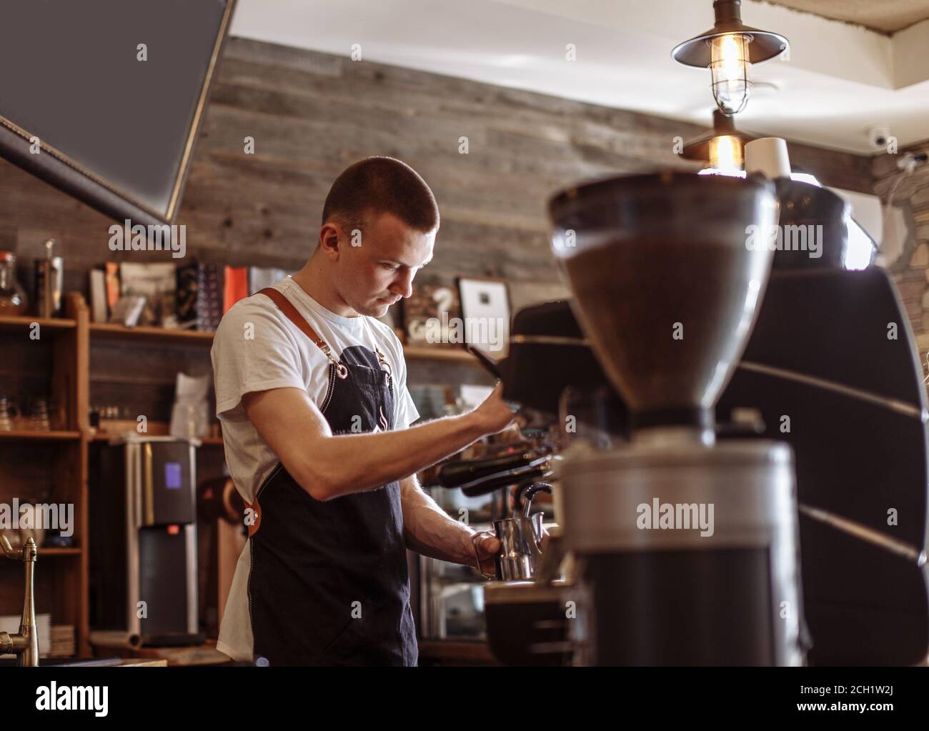 Side view male barista hi-res stock photography and images - Alamy