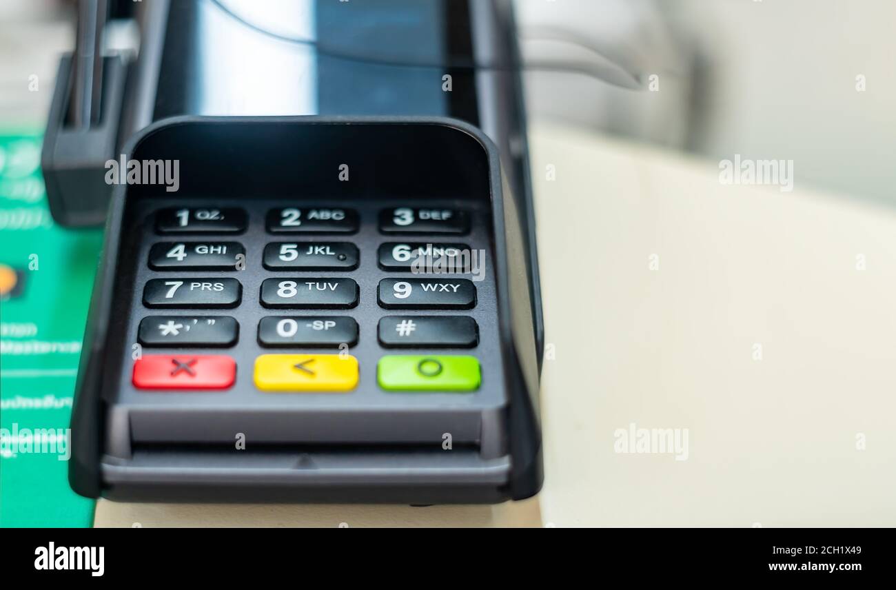 Credit card reader, selective focus blurred background, with copy space ...