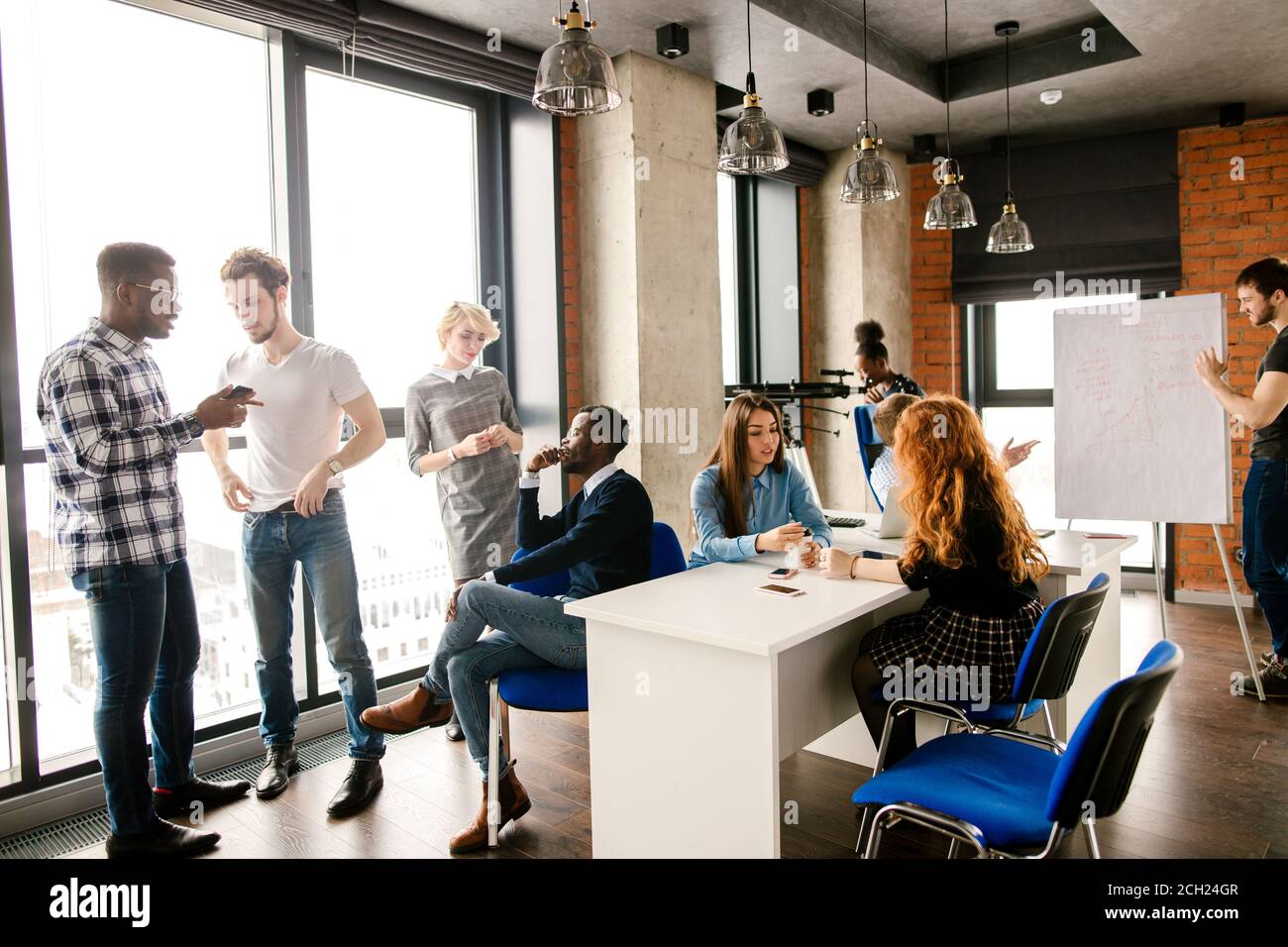 resting people in the small modern office Stock Photo - Alamy