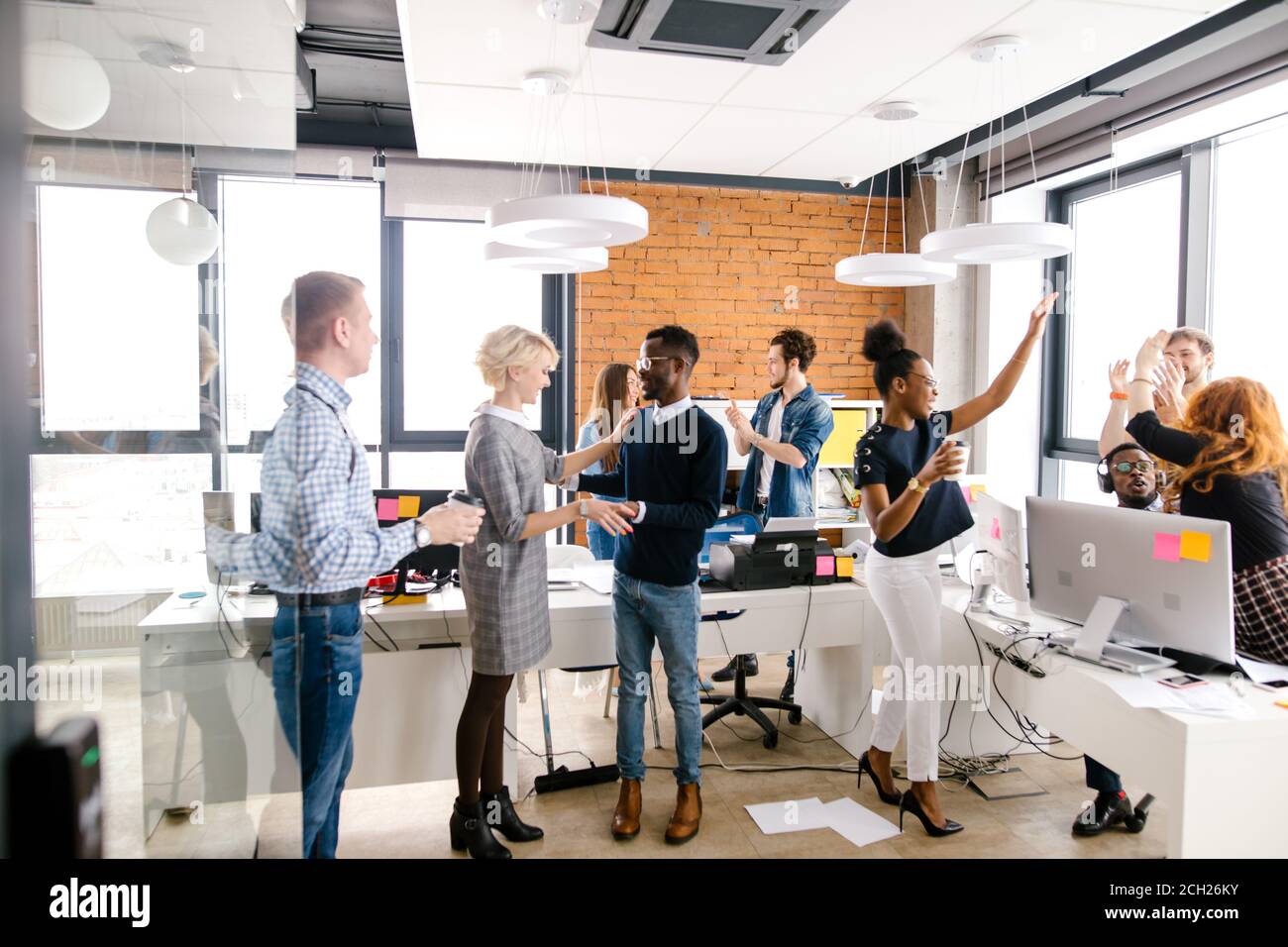 a couple of co-workers is dancing in the office party. couple dance in ...