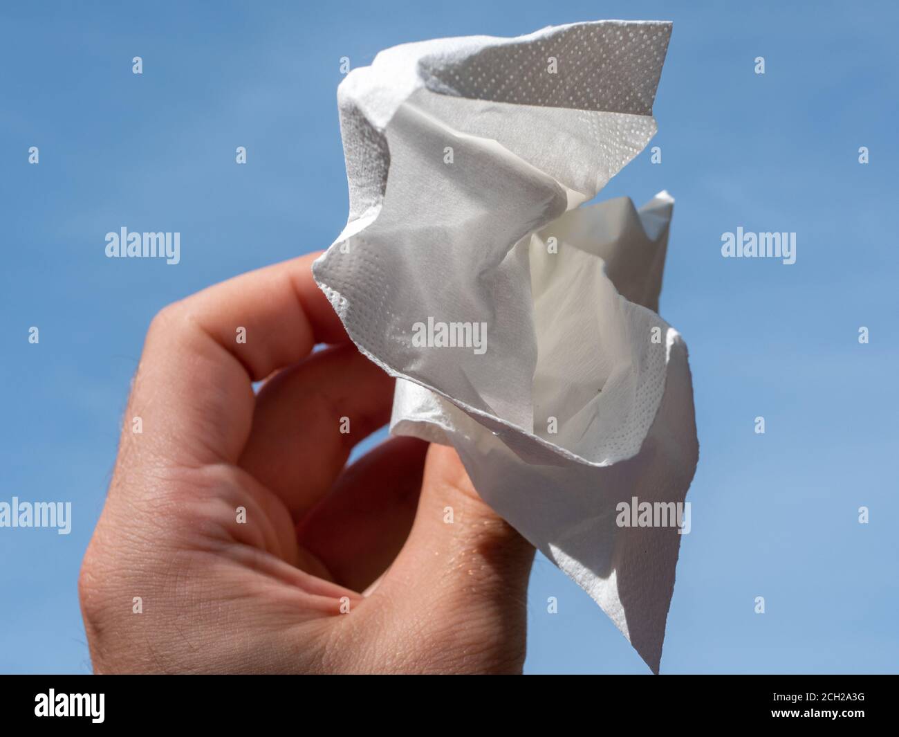 Hand with a tissue symbol Stock Photo - Alamy