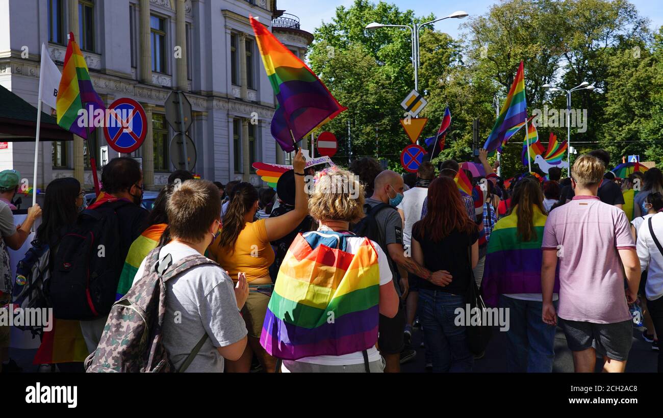 LGBT equality march. Young people wearing rainbow clothes are fighting ...