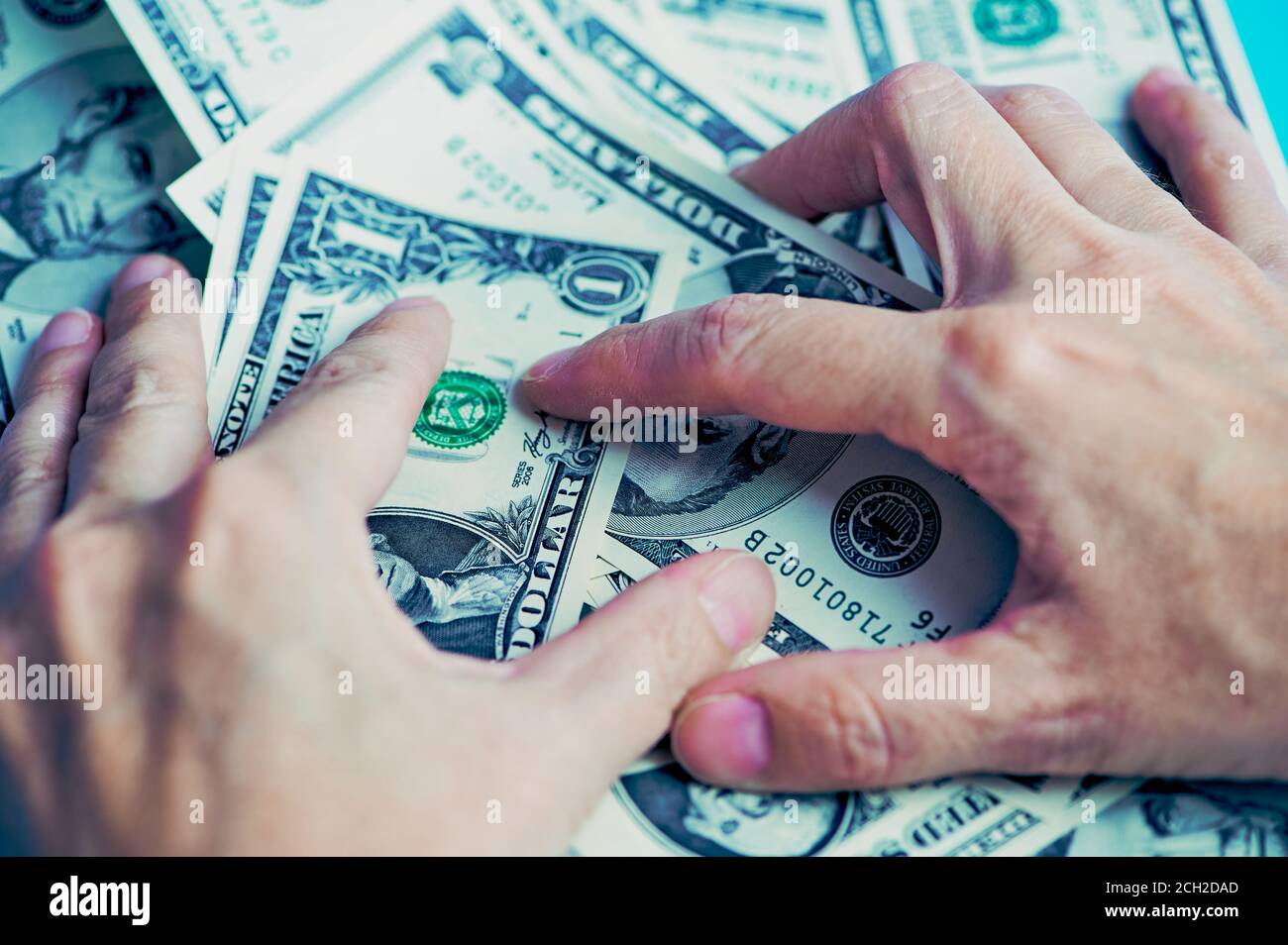 Hands grabbing cash hi-res stock photography and images - Alamy