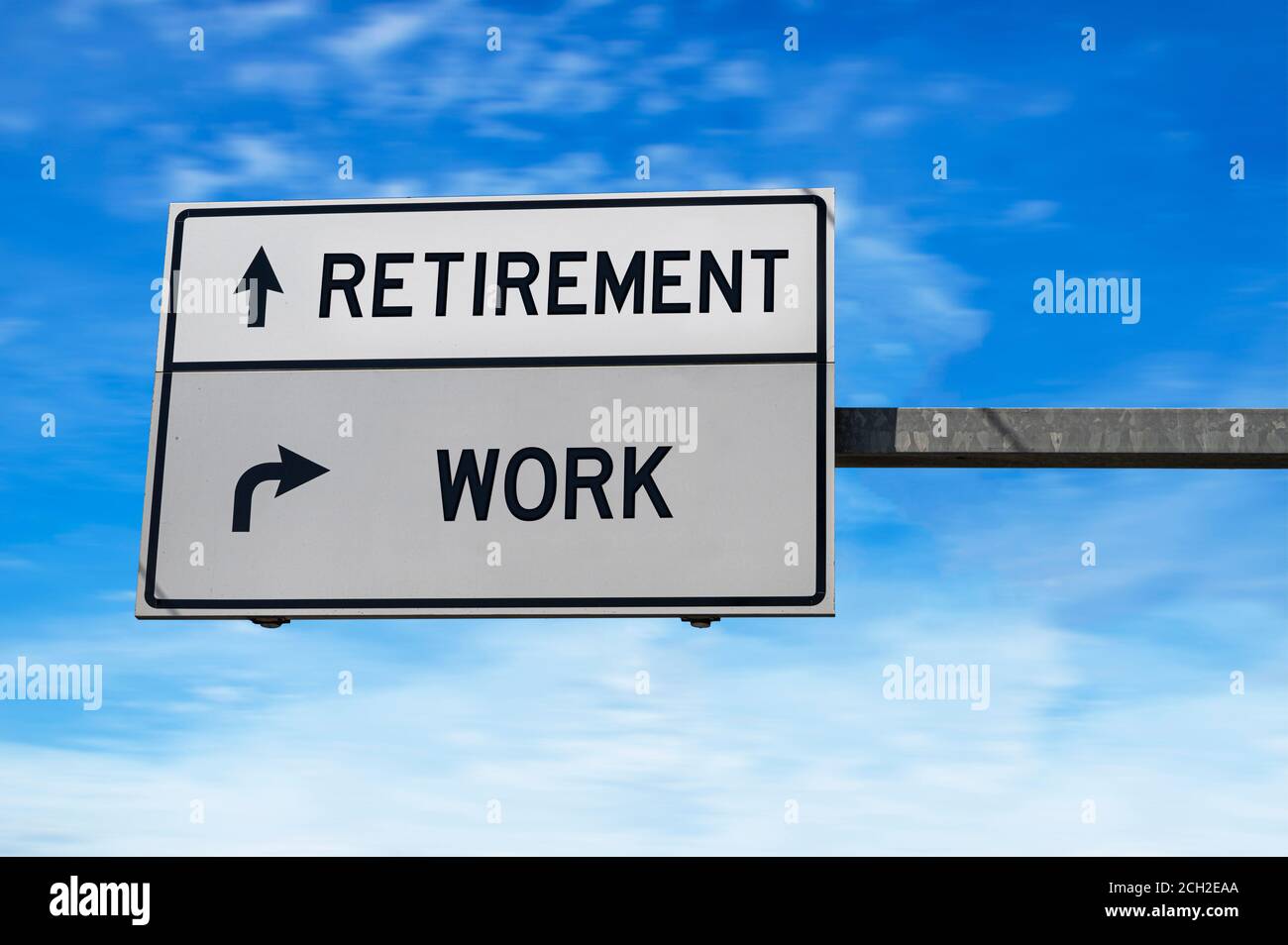 Retirement versus work white metal road sign on blue sky background ...
