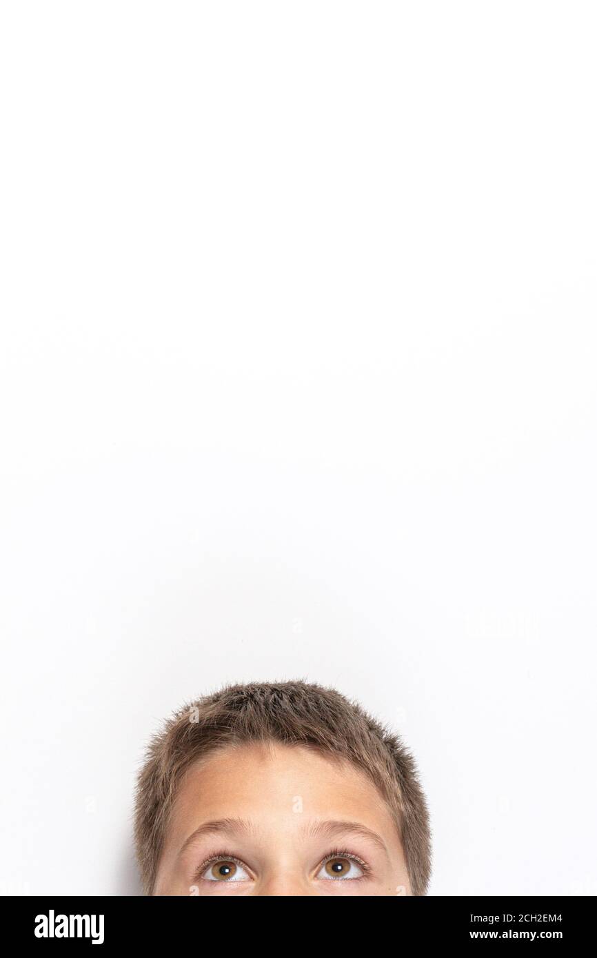 Closeup portrait headshot cropped face of boy looking up isolated on ...