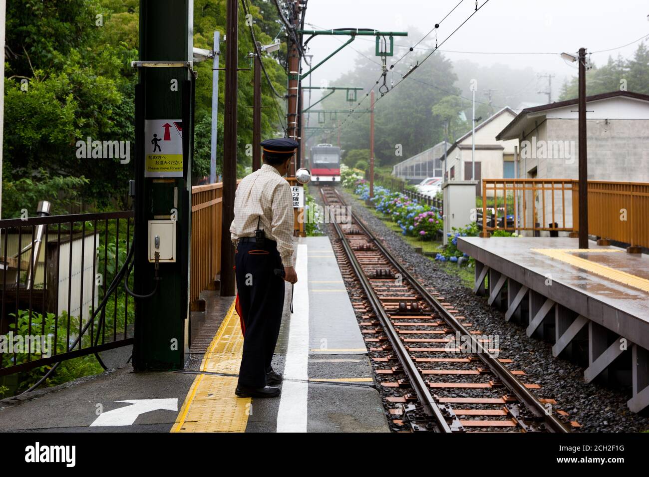 Hakone / Japan - June 19, 2018: Conductor waiting for the Hakone Tozan ...