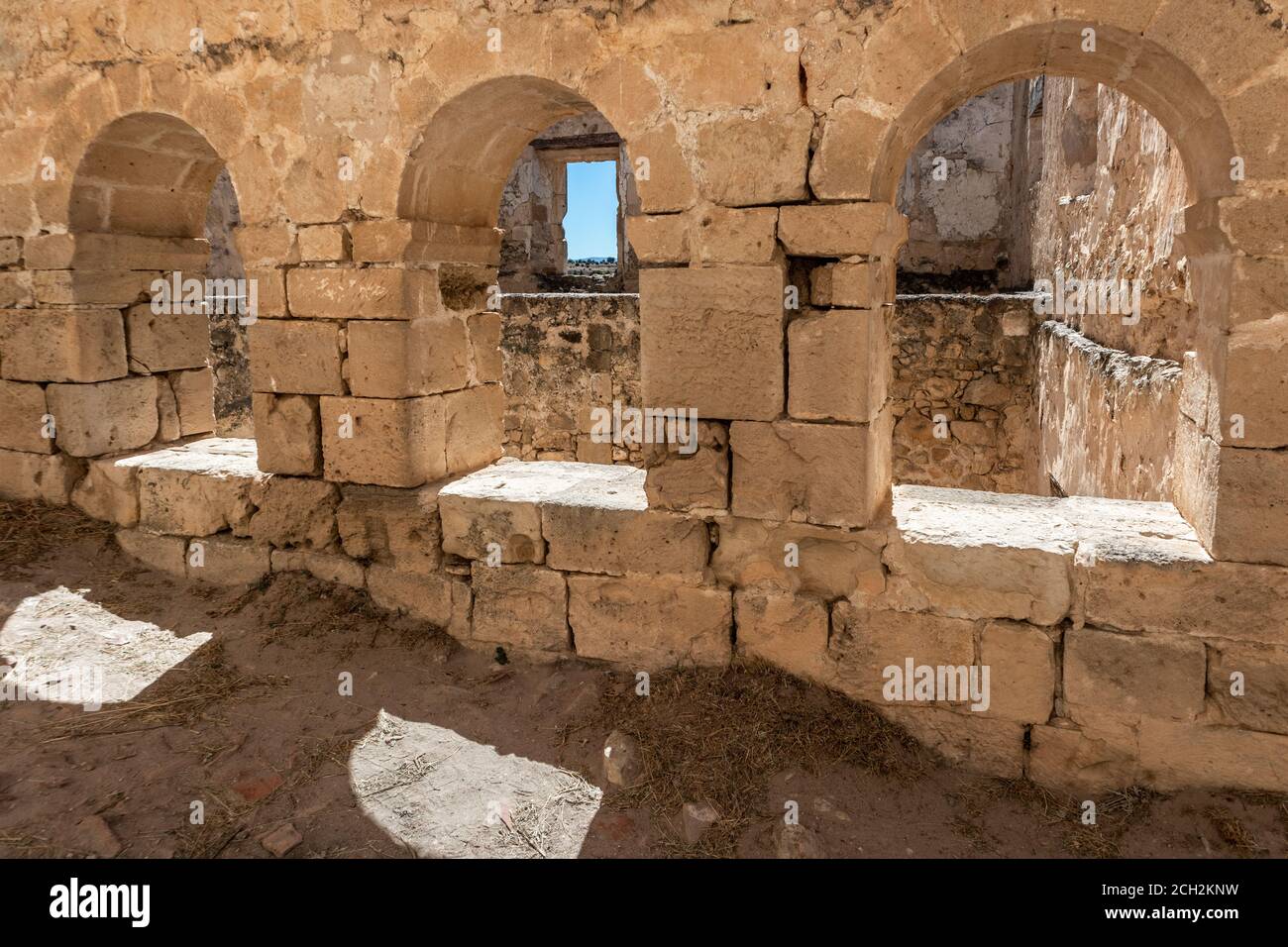 Interior of romanesque church Ermita de San Frutos. Round arches on ...