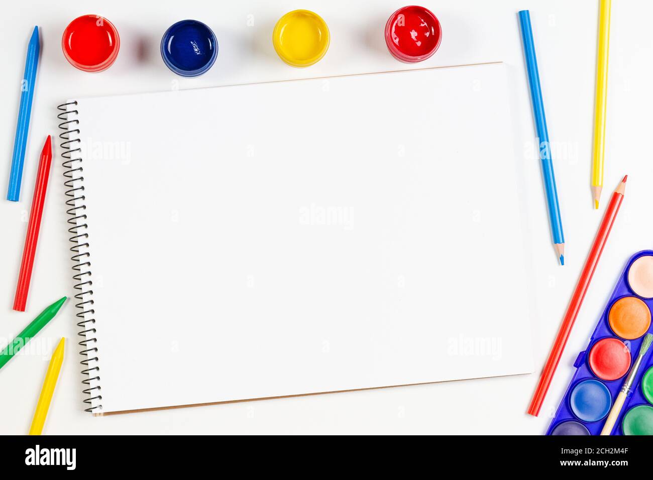 Learning, hobby, art background. Empty sketchbook with art supplies ...