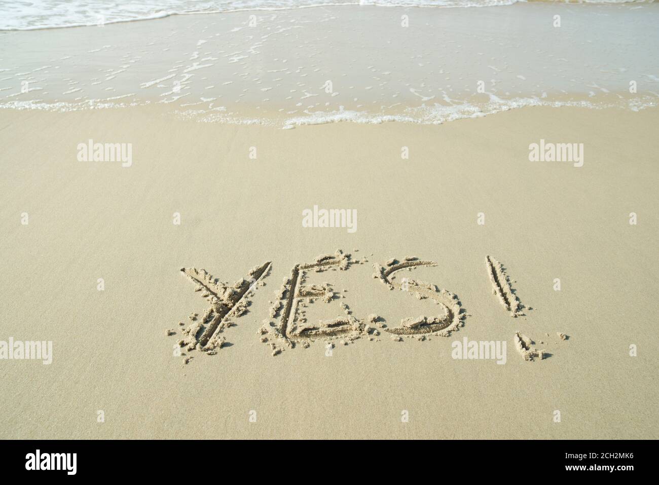YES concept, word written on sand beach Stock Photo - Alamy