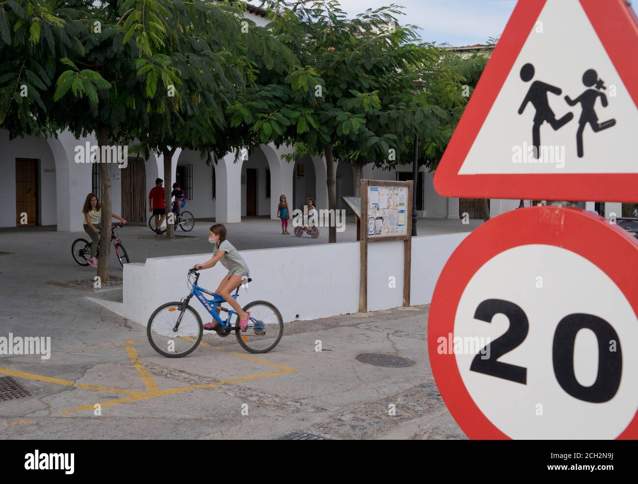 Children cycling wearing face masks due to Covid-19 Coronavirus ...