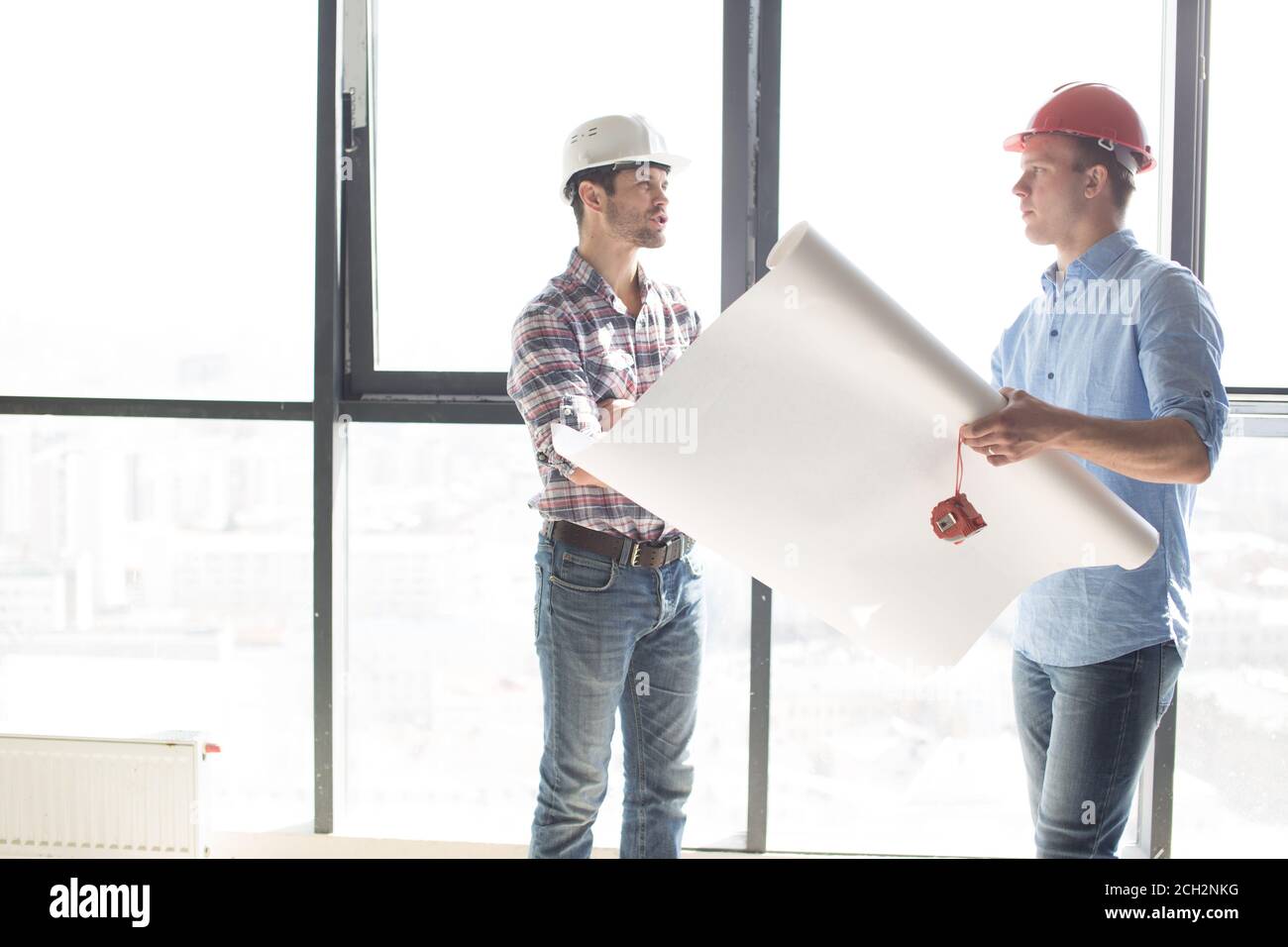 strict angry boss isn't satisfied with his engineer's work. side view ...