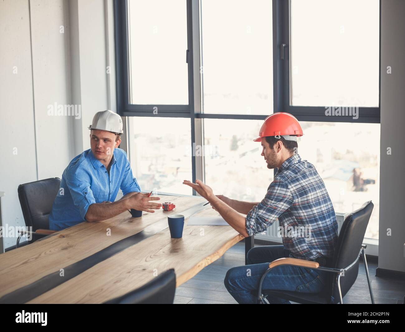 Engineers talking in urban building hi-res stock photography and images ...