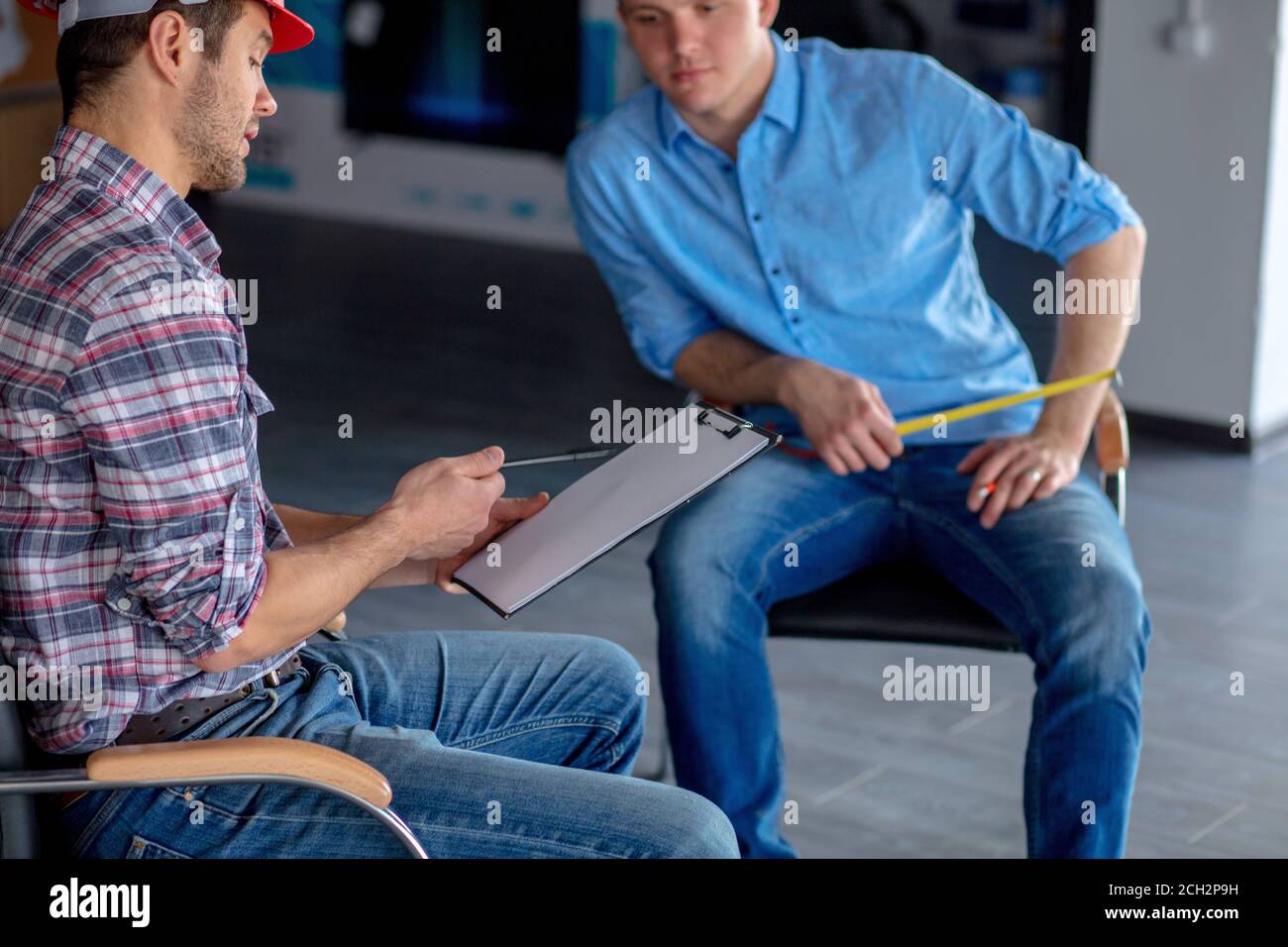 a journalist is conducting an interview with experienced engineer ...