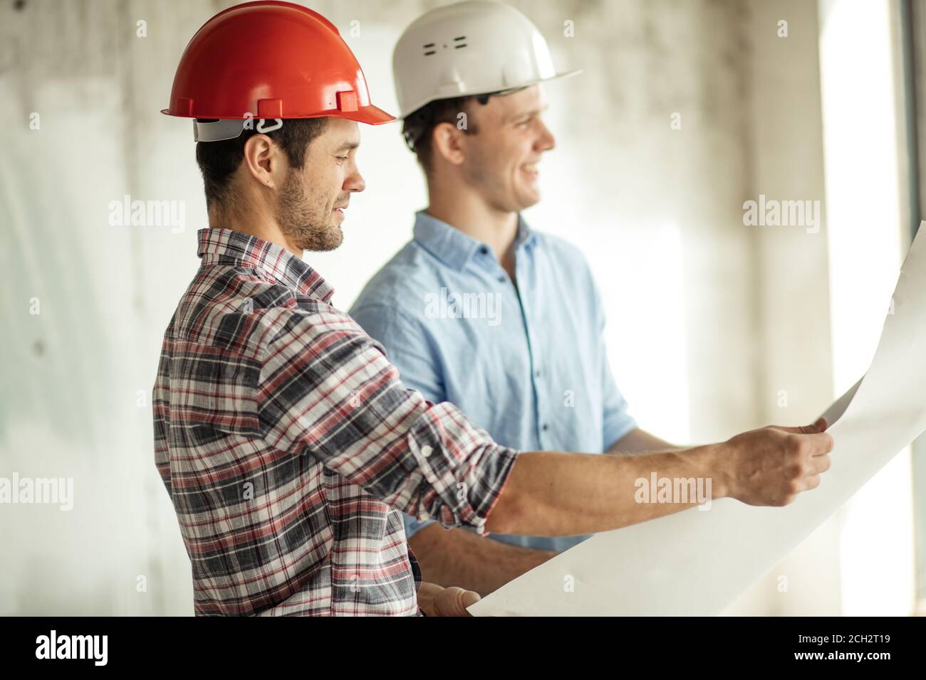 creative builders with creative plans. engineering. close up side view ...