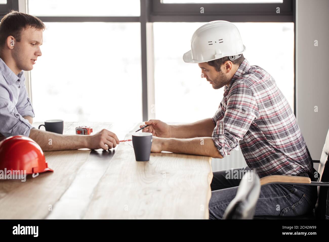 Two builders planning work hi-res stock photography and images - Alamy