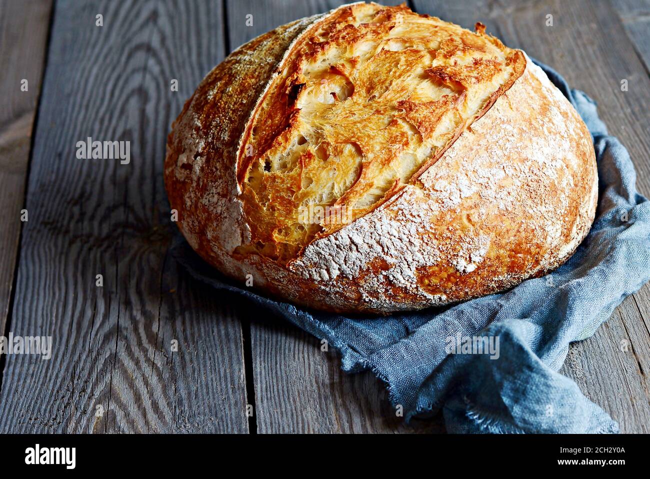 Fresh homemade bread on a gray( blue) background. Crisp French bread ...