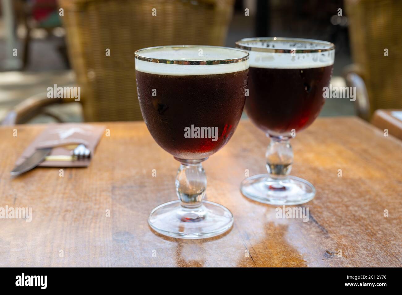 Glasses with cold dark strong Belgian abbey beer served outdoor Stock ...
