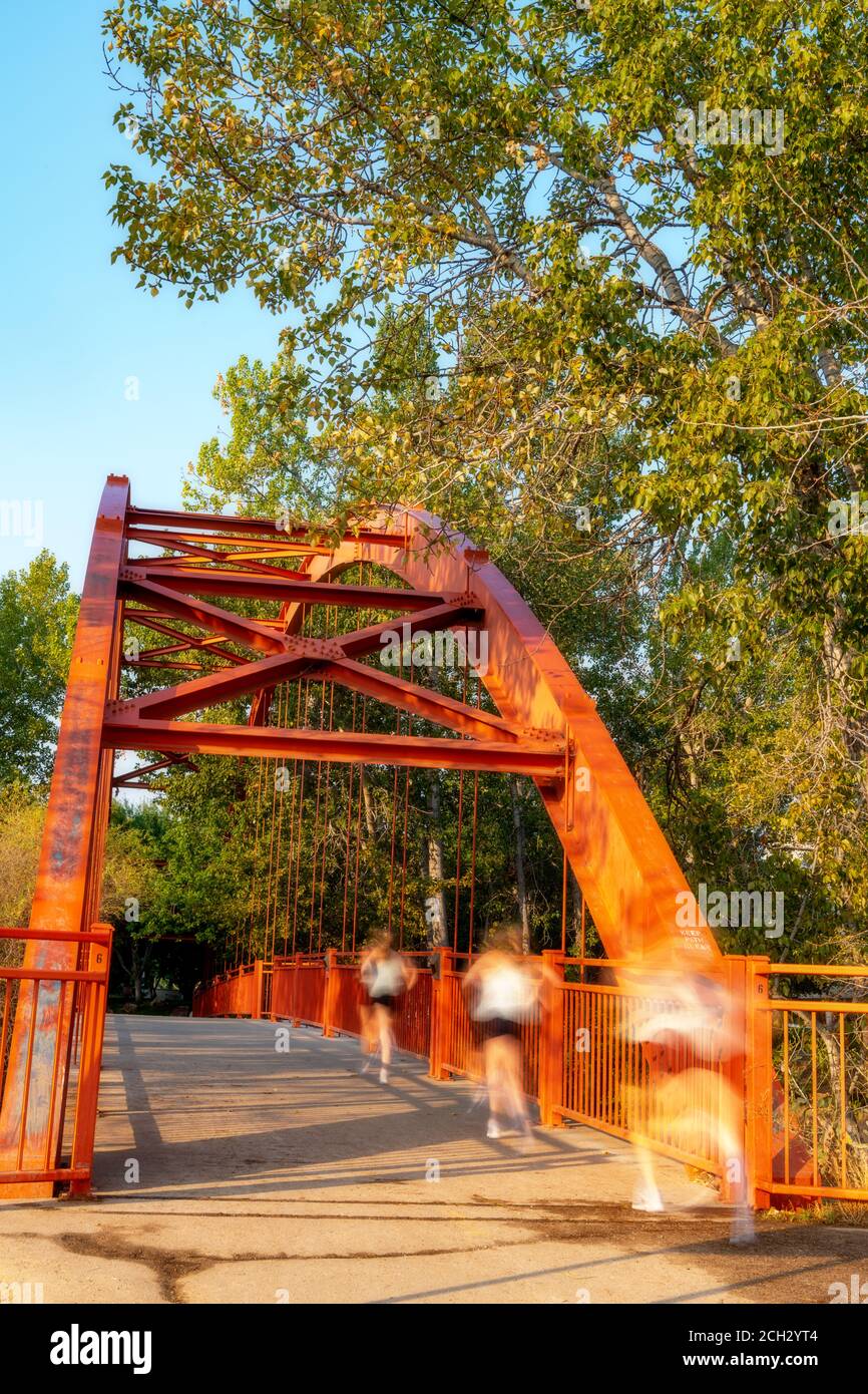 Boise River bridge motion blur runner crosses Stock Photo - Alamy