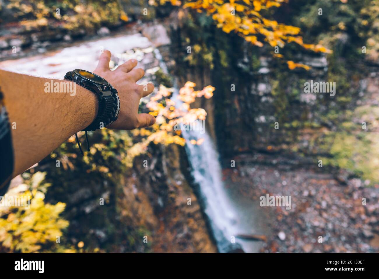first person view man hands showing waterfall Stock Photo - Alamy
