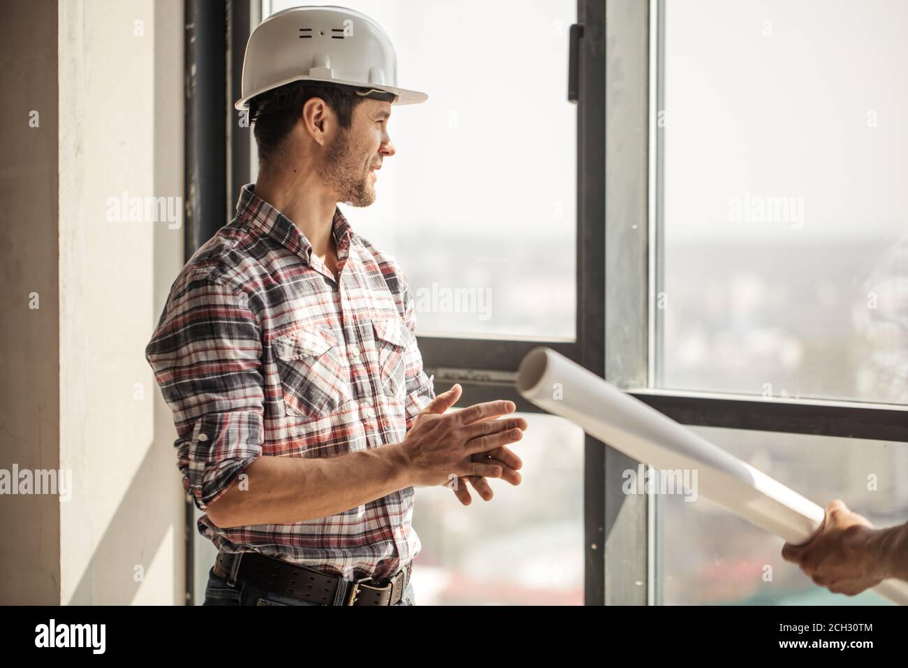 engineer has finished to prepare a draft of building . side view close ...