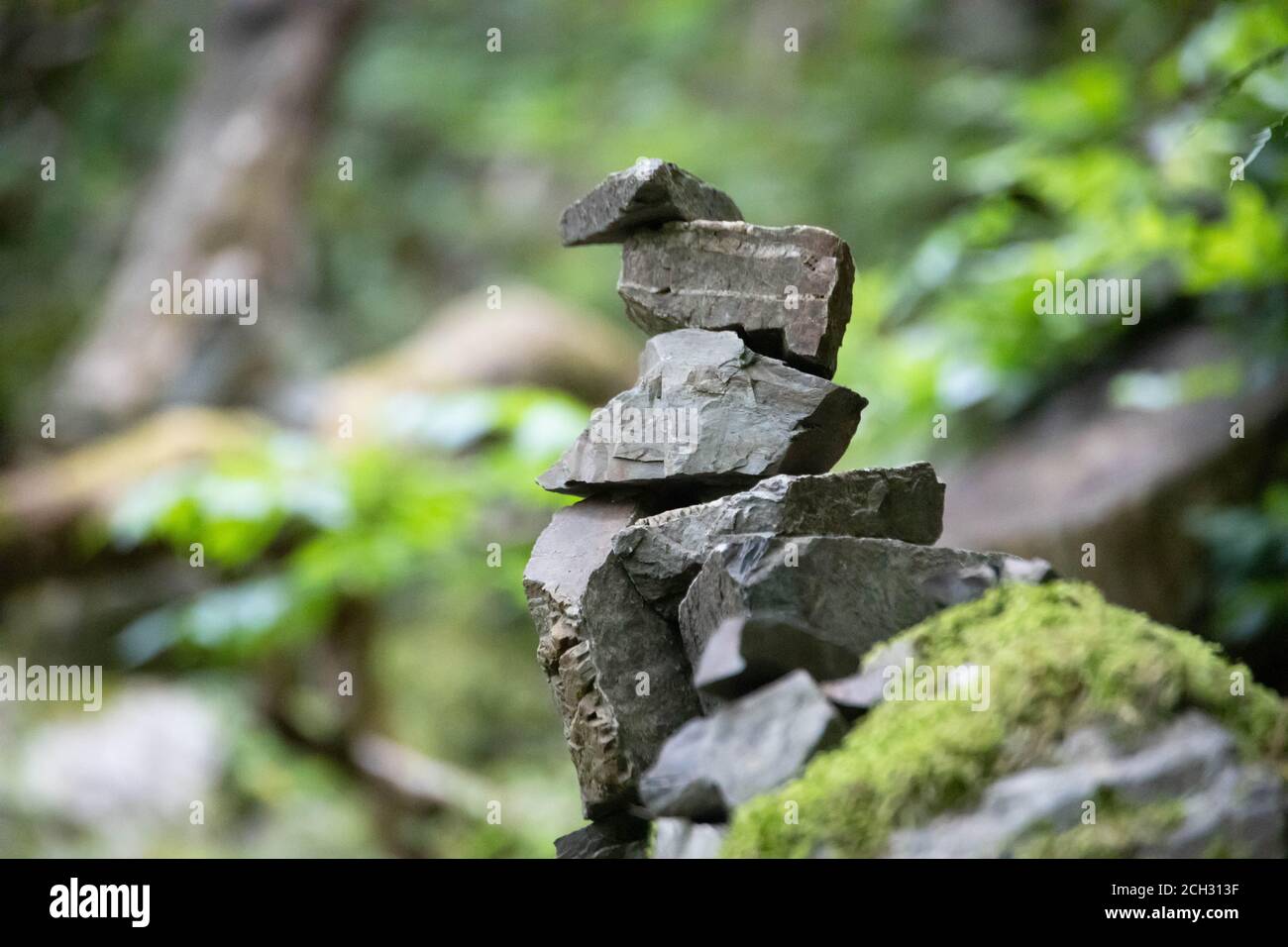 A stack of stones stands on top of each other. Mysterious ritual ...