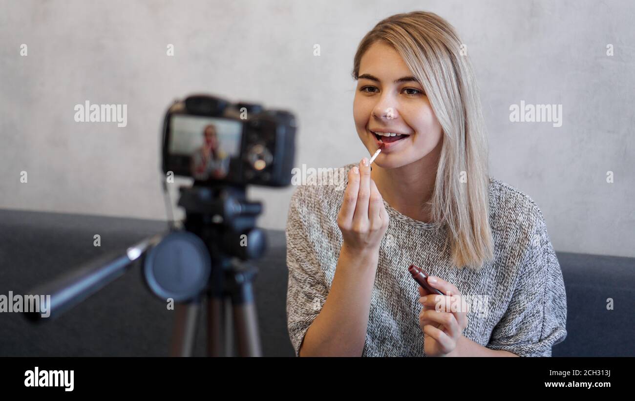 A beauty blogger or video blogger tells and shows subscribers how to do ...