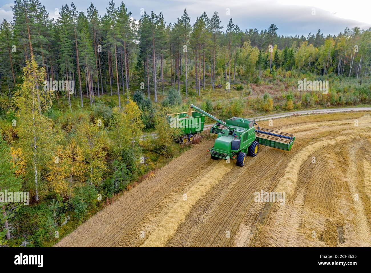 Aerial view harvester machine unloading hi-res stock photography and ...