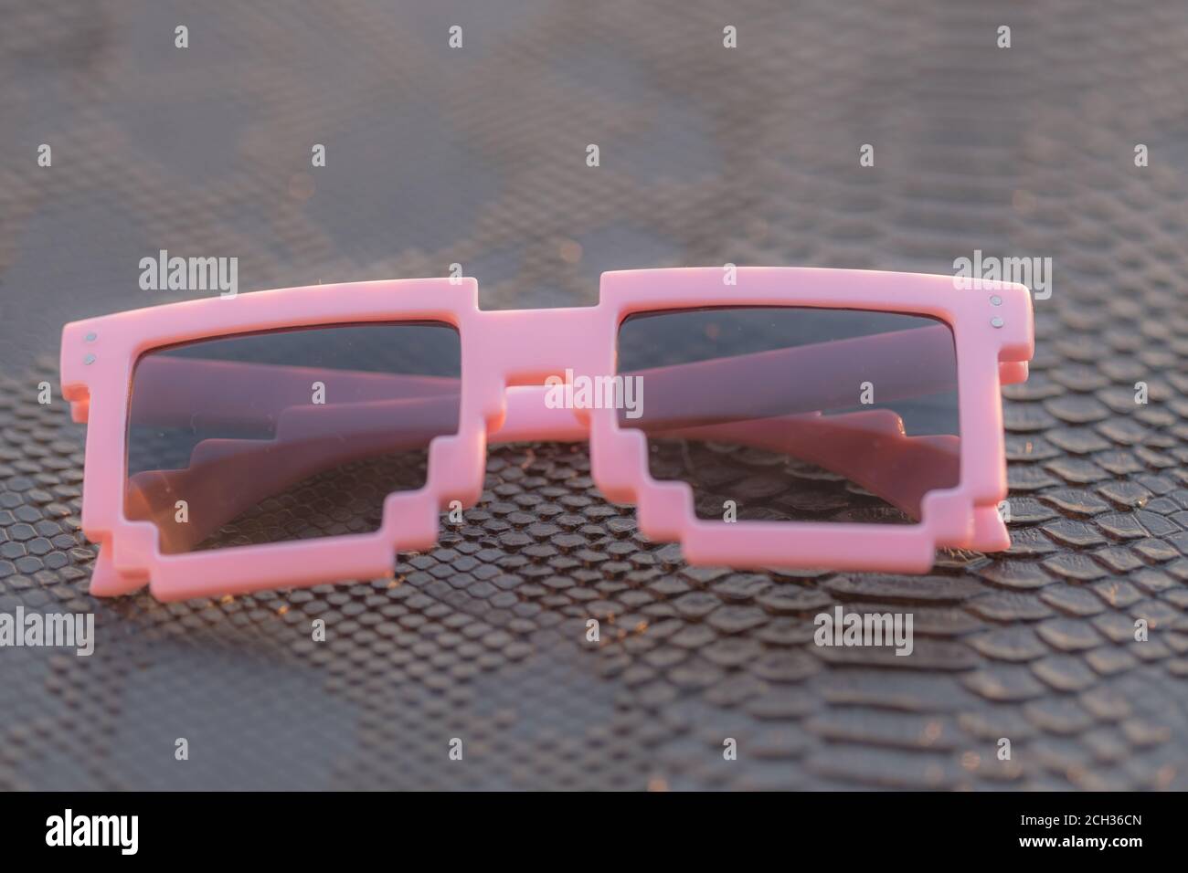 Pixel sunglasses model with black lenses closeup in a summer day ...