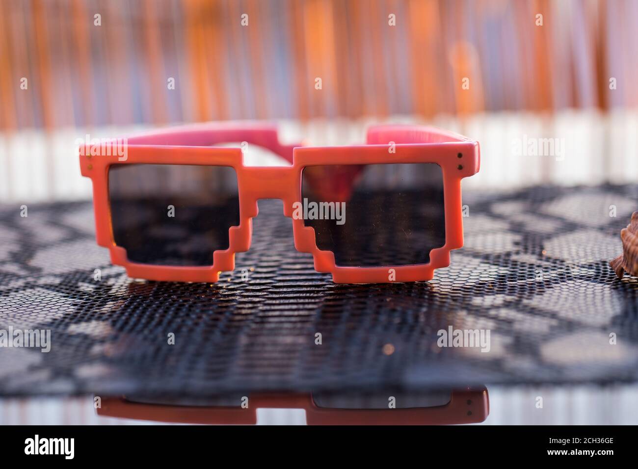 Pixel sunglasses model with black lenses closeup in a summer day ...