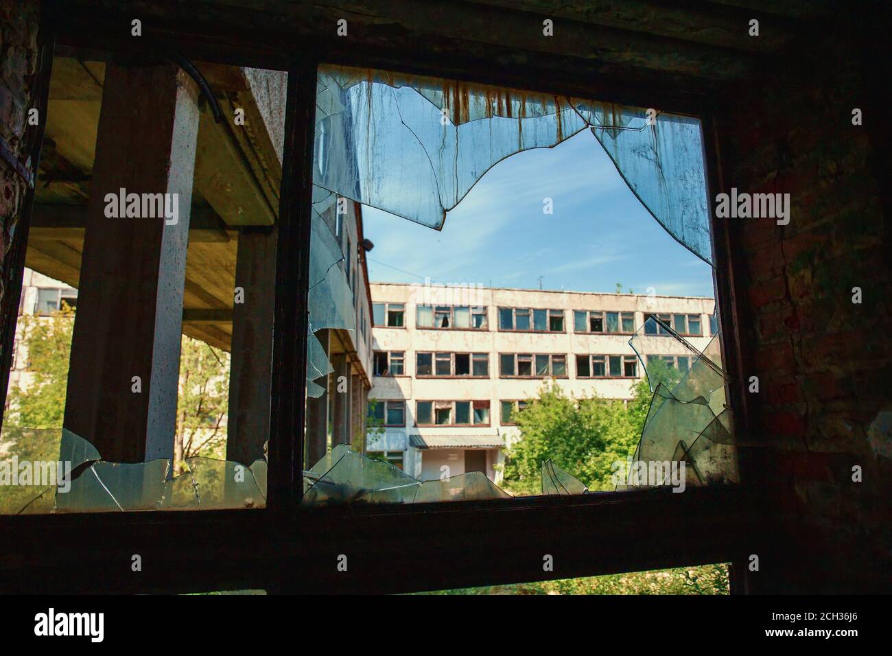 Abandoned industrial building with broken window glass, close up Stock ...